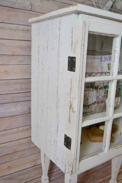 Repurpose old windows into a beautiful DIY window cabinet for your home.