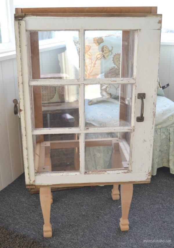 Repurpose old windows into a beautiful DIY window cabinet for your home.